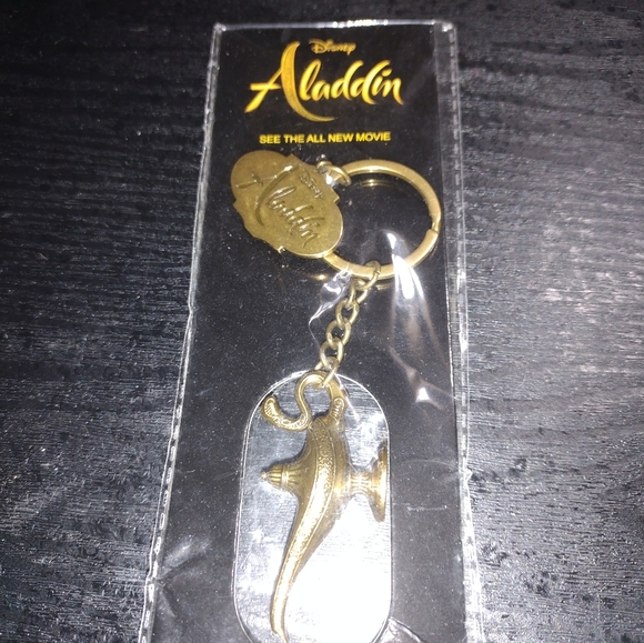 Disney | Accessories | Disney Aladdin Gold Logo Keychainbag Charm With ...